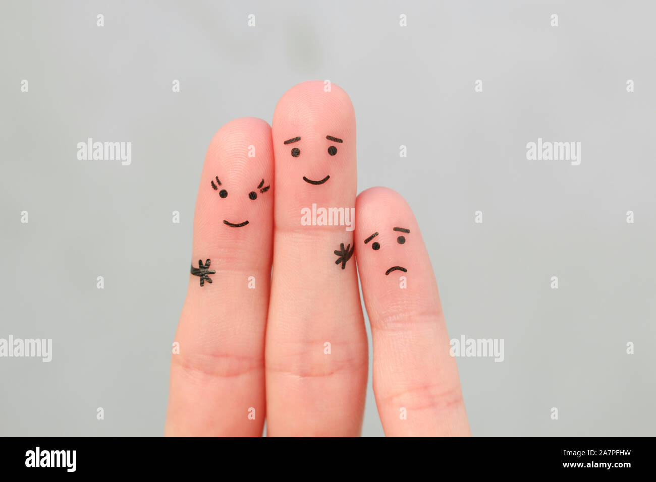 Fingers art of happy couple. Man kisses woman on cheek. Child is angry ...
