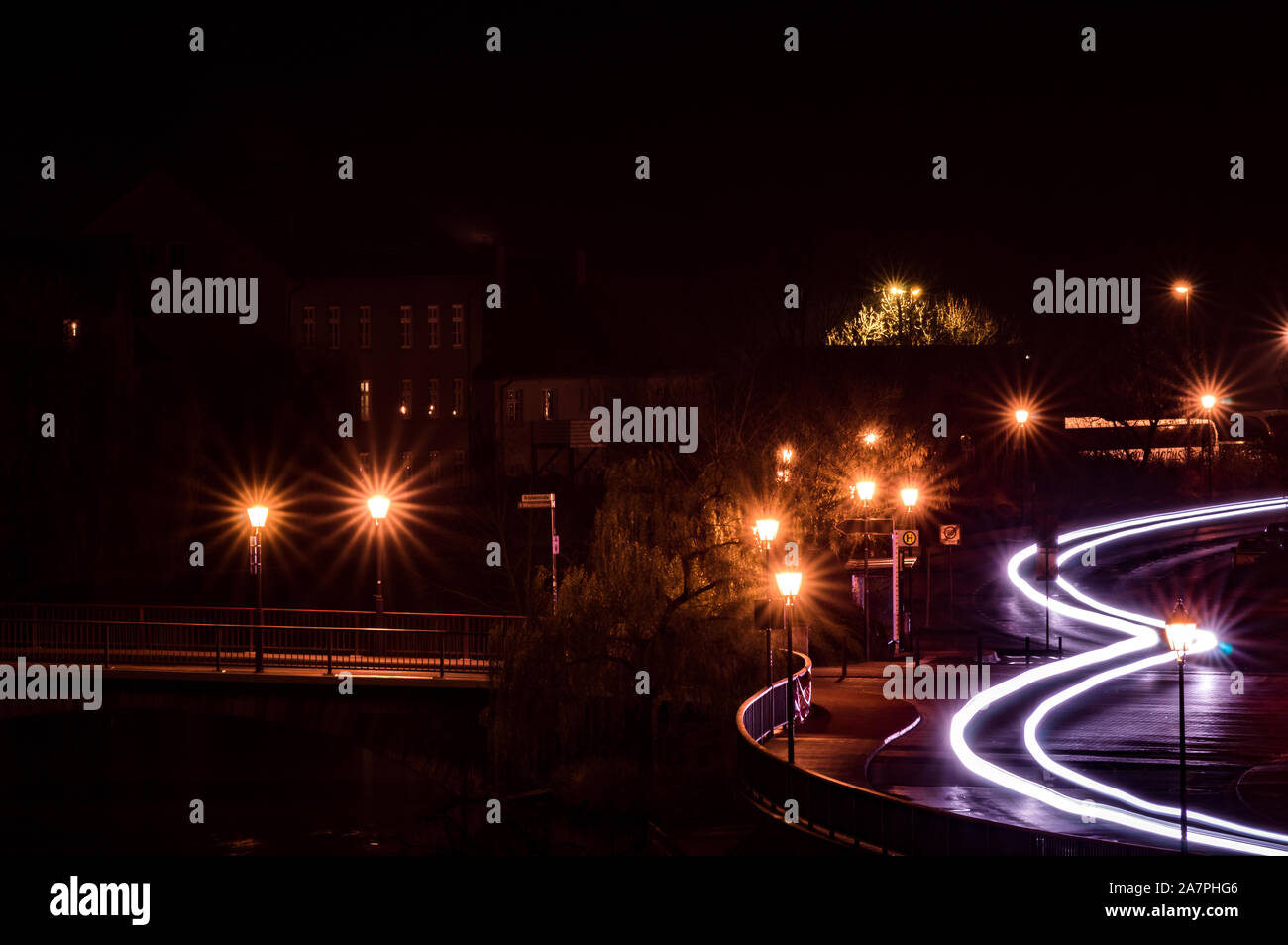 Busy village road at night Stock Photo - Alamy