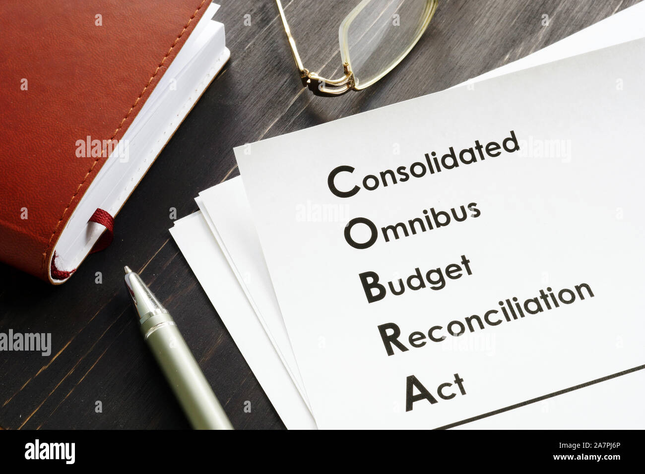 COBRA Consolidated Omnibus Budget Reconciliation Act on the desk Stock ...