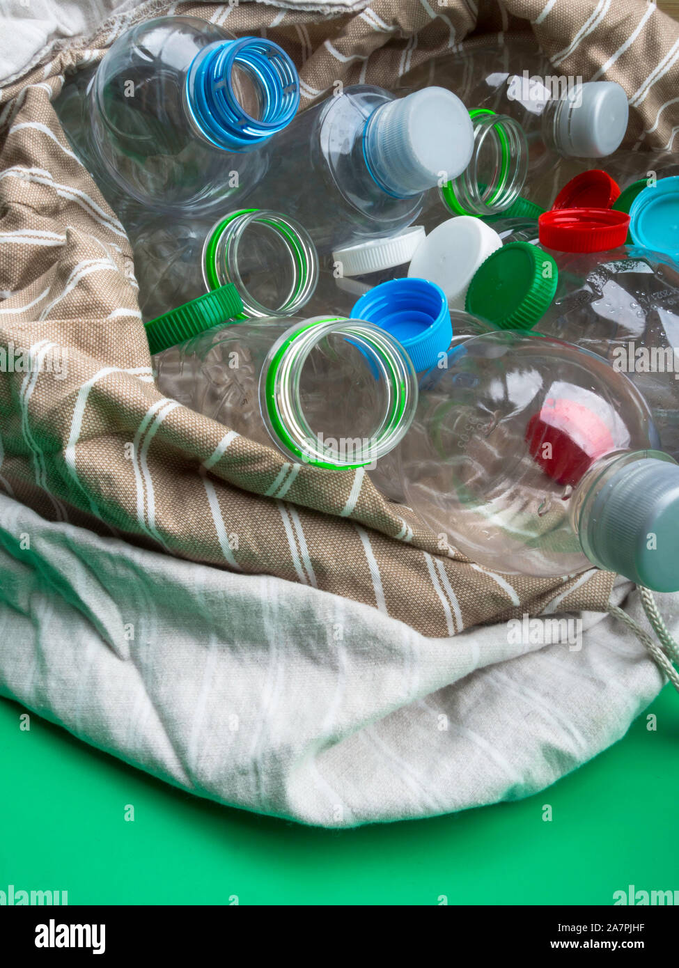 Transparent plastic bottles recycling in eco bag, recycle concept Stock ...