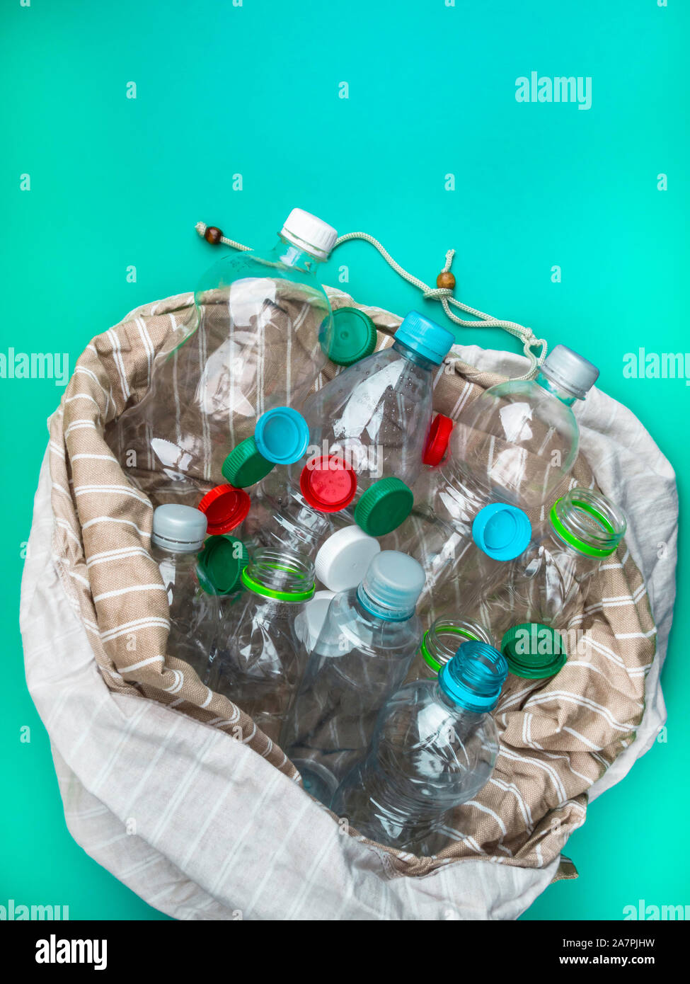 Transparent plastic bottles recycling in eco bag, recycle concept Stock ...