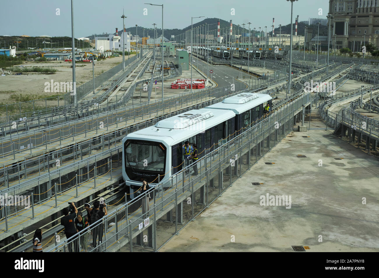 Chinese workers introduce the Light Rail Transit (LRT) system at the ...