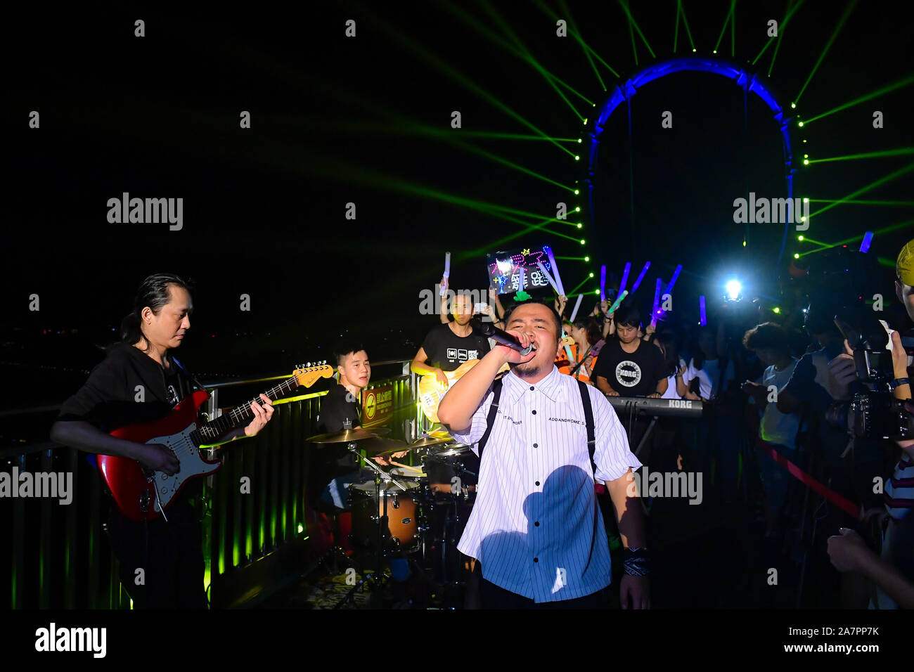 Members of Chinese bands perform on the Guangdong's highest circular ...