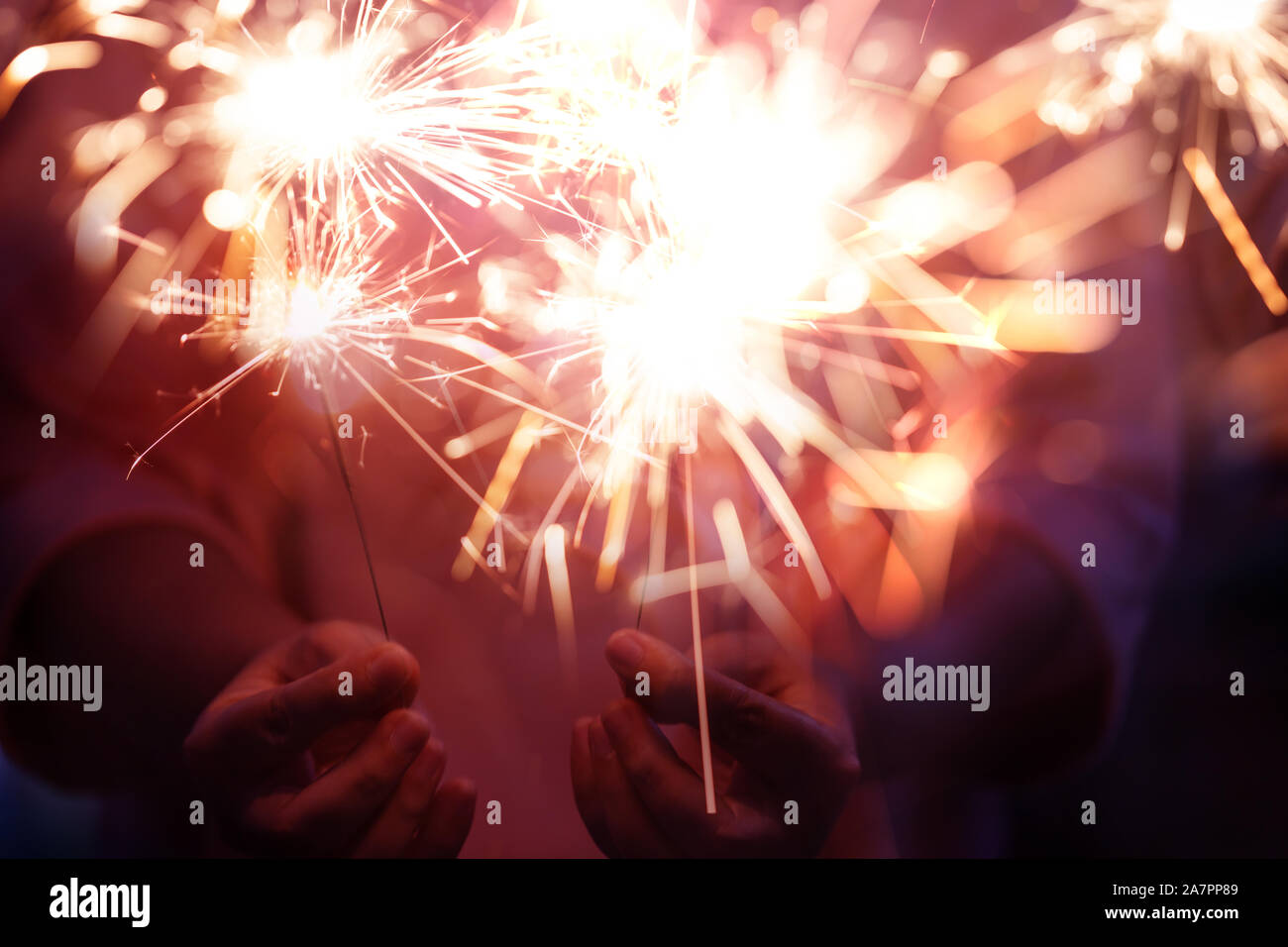 Hand of woman holding firework firework pyrotechnics and bokeh with ...