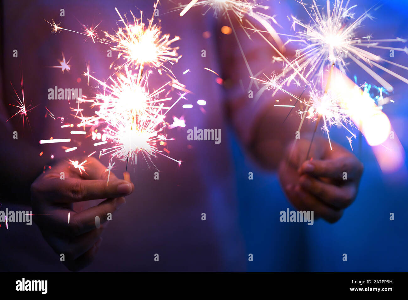 Hand of woman holding firework firework pyrotechnics and bokeh with ...