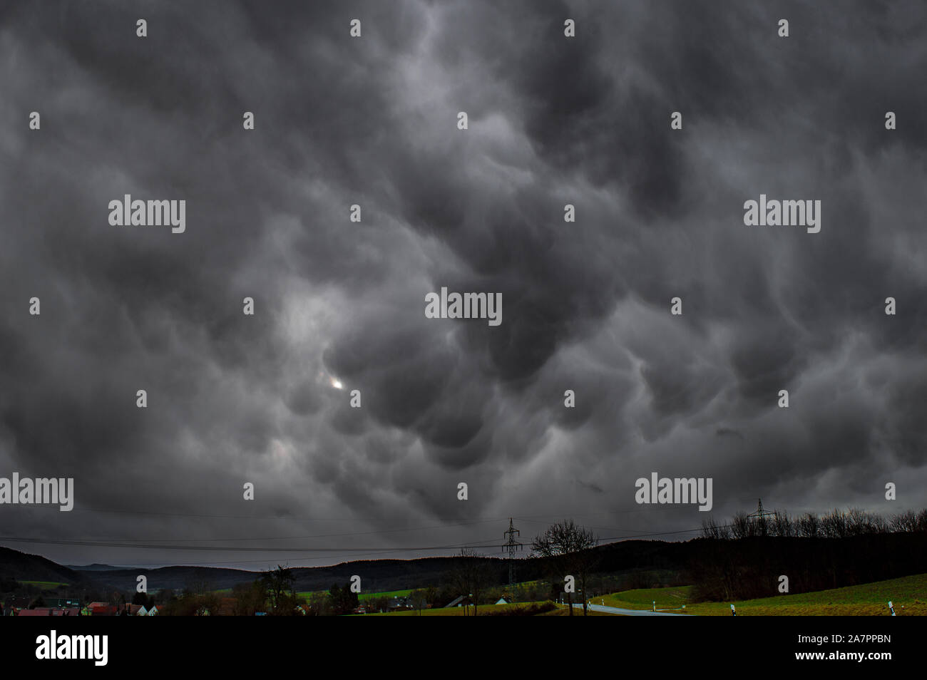Storm Clouds over forest dark Stock Photo - Alamy