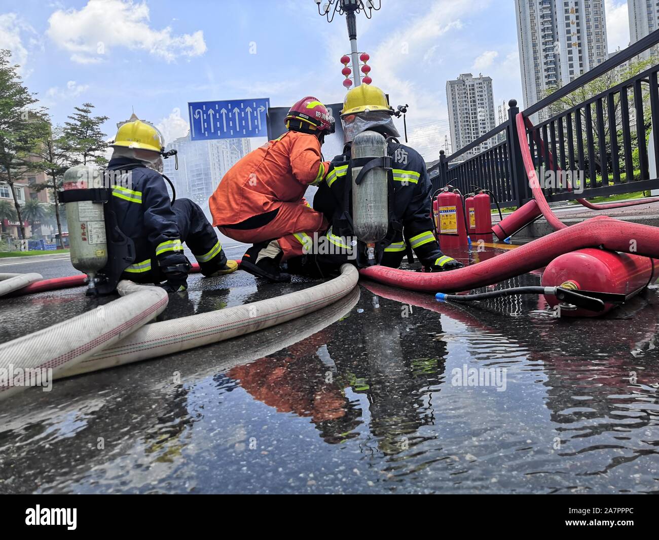 Firemen put out fire caused by the truck with water in Guangzhou city ...