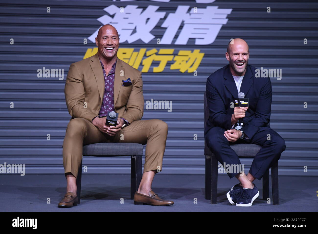 English actor Jason Statham, right, and American actor Dwayne Johnson attend a press conference ...