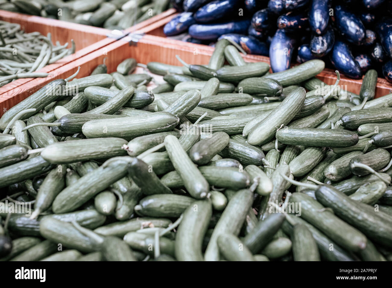 Piled fresh cucumber on display for sale at supermarket Stock Photo - Alamy