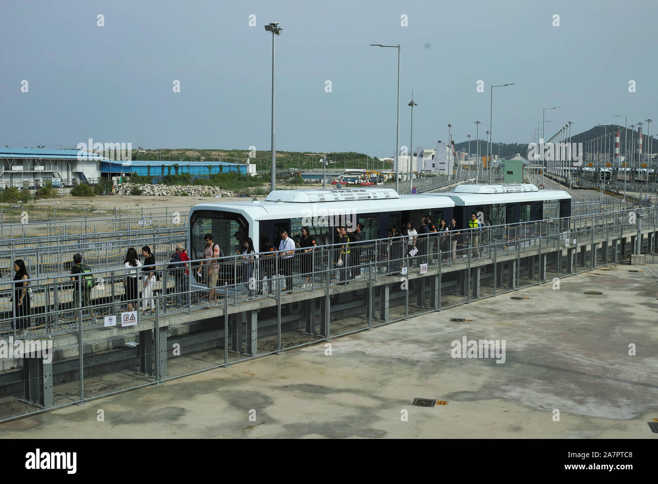 Chinese workers introduce the Light Rail Transit (LRT) system at the ...