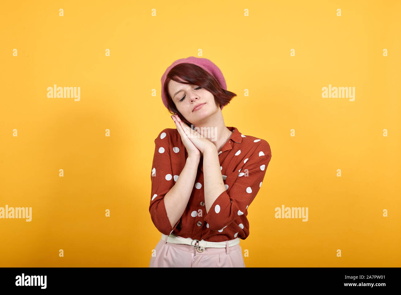 Gorgeous young caucasian girl making sleep gesture in dorable ...