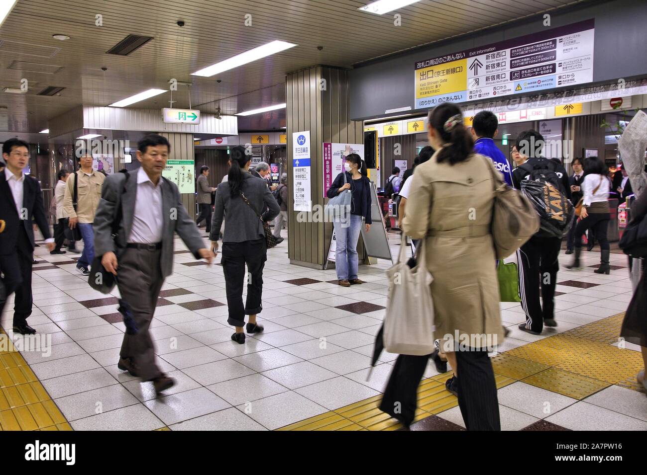 TOKYO, JAPAN - MAY 9, 2012: People enter Tokyo Metro station. With more ...