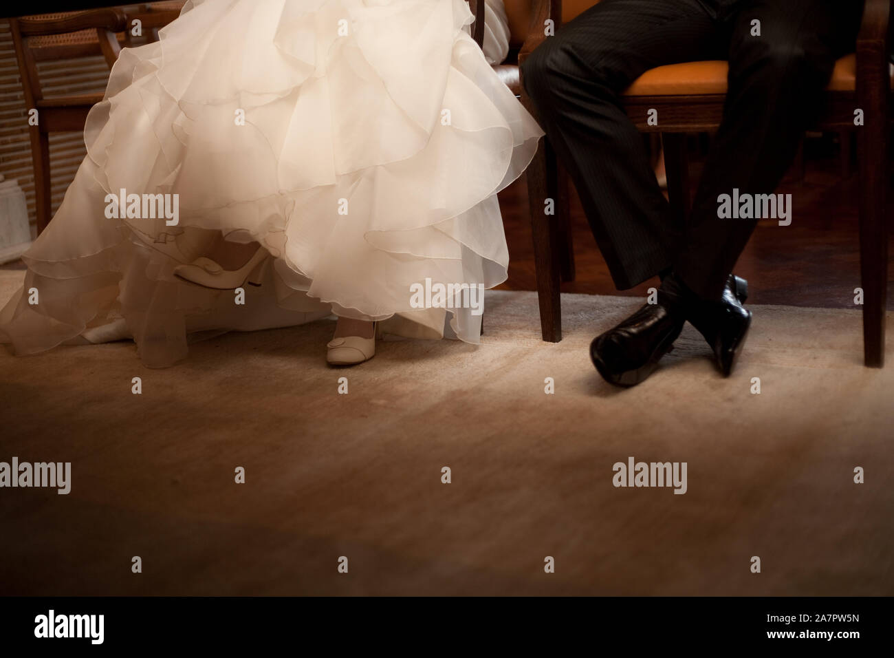 Man standing feet on chair hi-res stock photography and images - Alamy