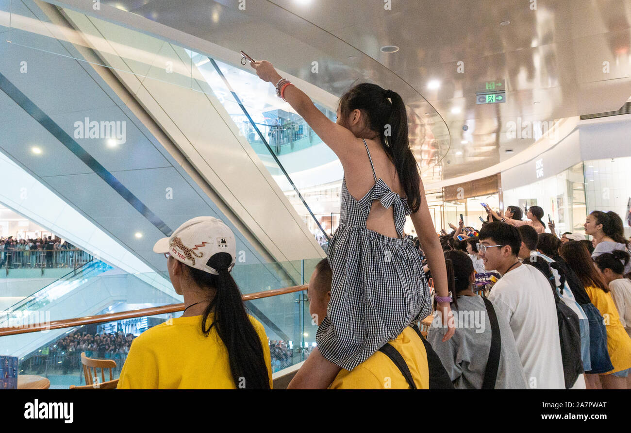 Chinese fans crowd a shopping mall to support singer and actor Karry ...