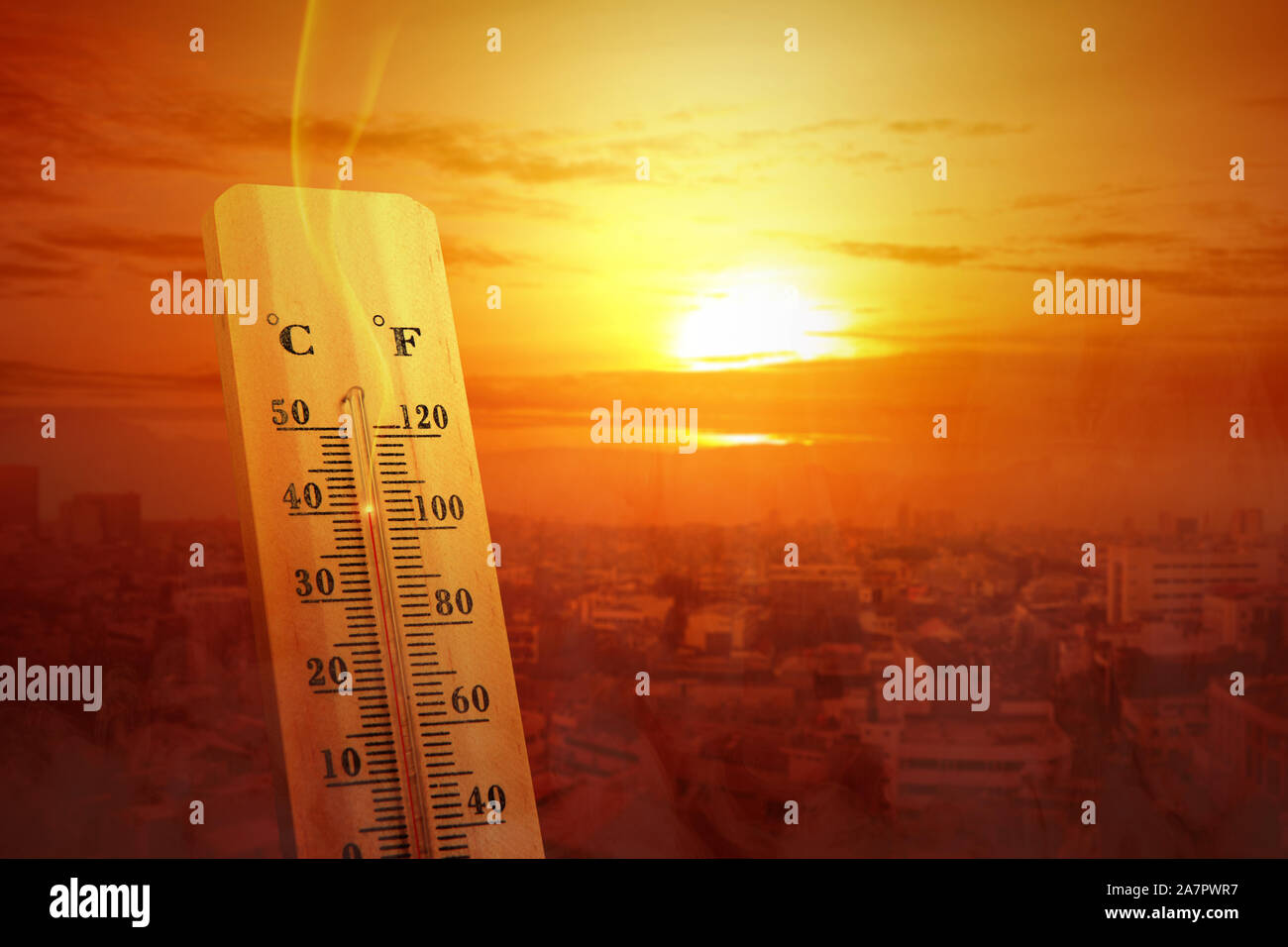 Thermometer with high temperature on the city with glowing sun ...
