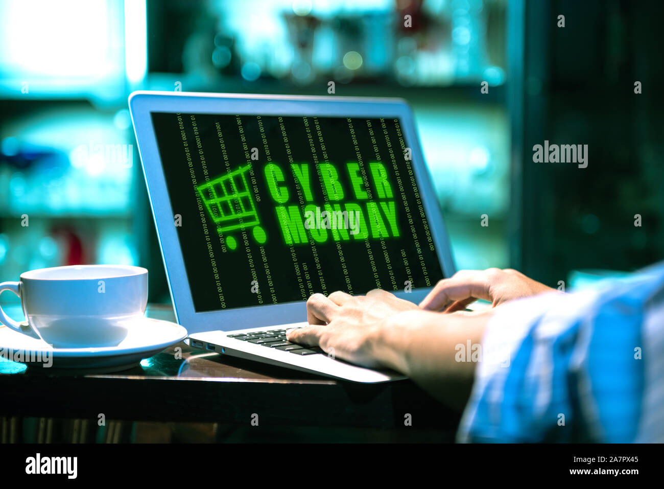Businessman with Cyber Monday advert on the laptop screen on the desk ...