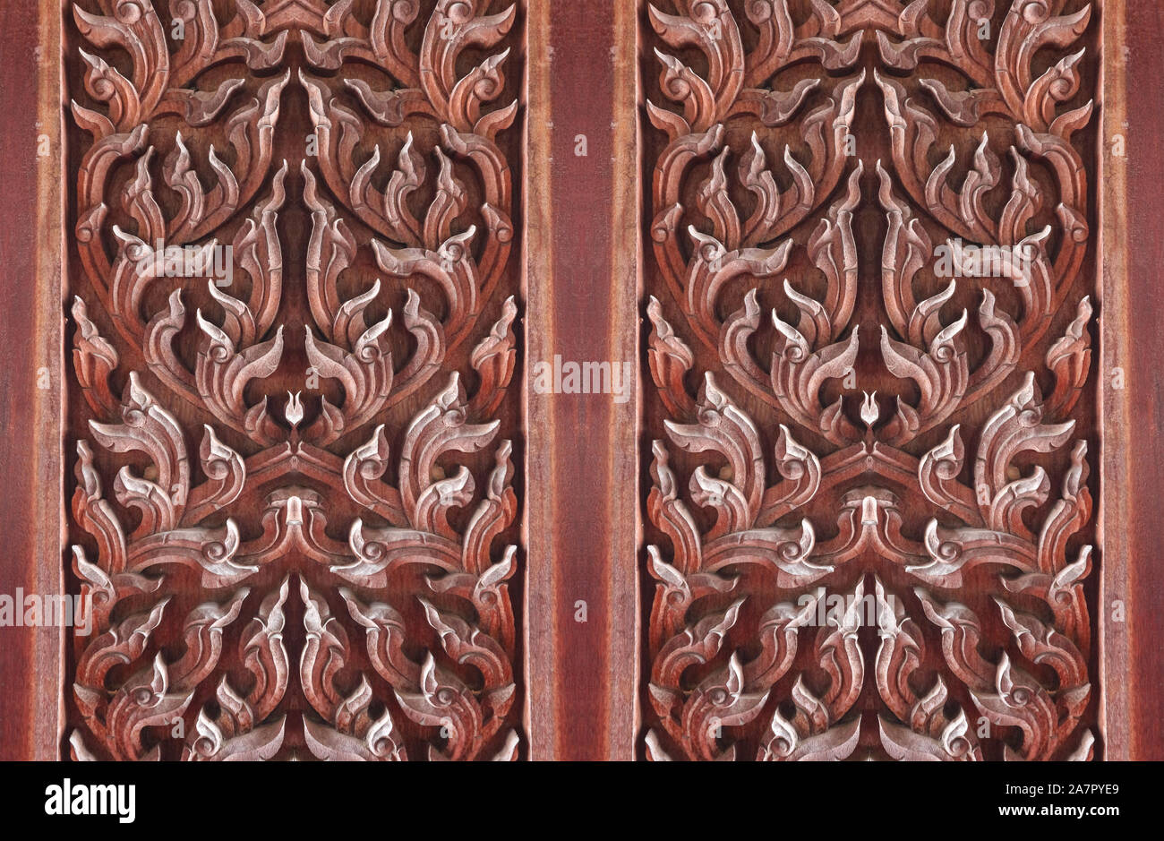 Thai craving in Kanok pattern wood door wall background Stock Photo - Alamy