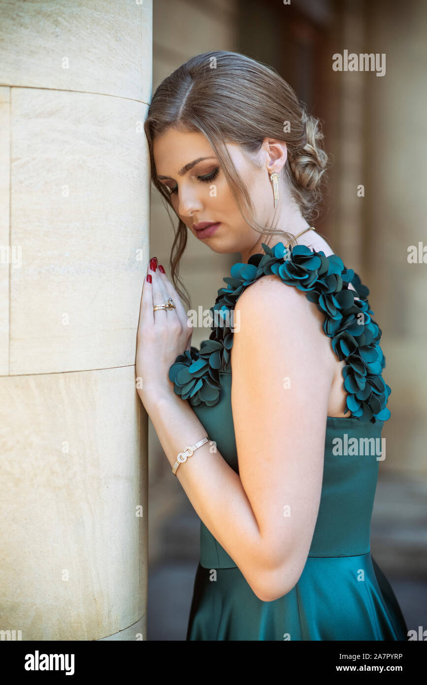 Woman leaning against wall eyes closed hi-res stock photography and ...
