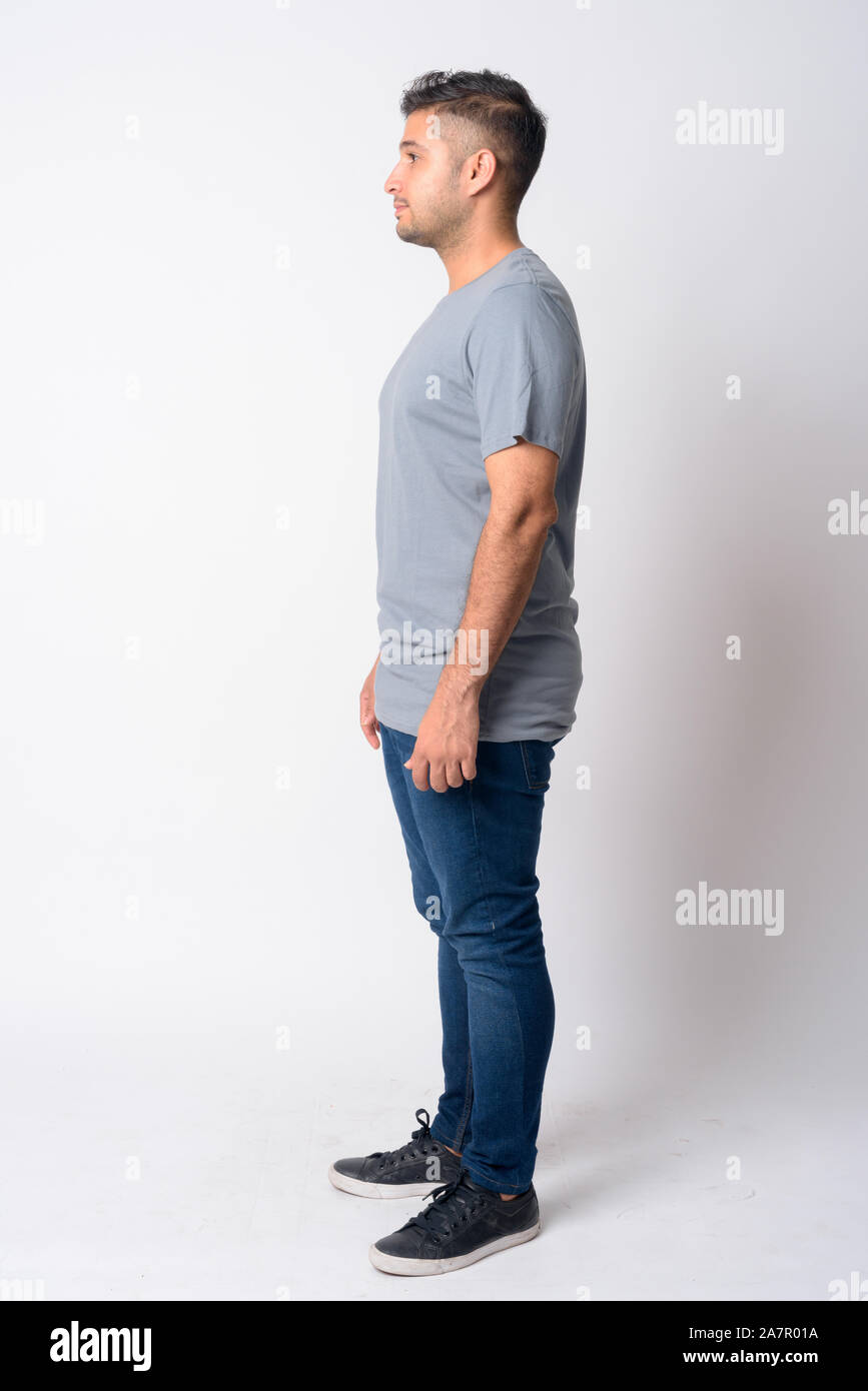 Full body shot profile view of young Persian man Stock Photo - Alamy