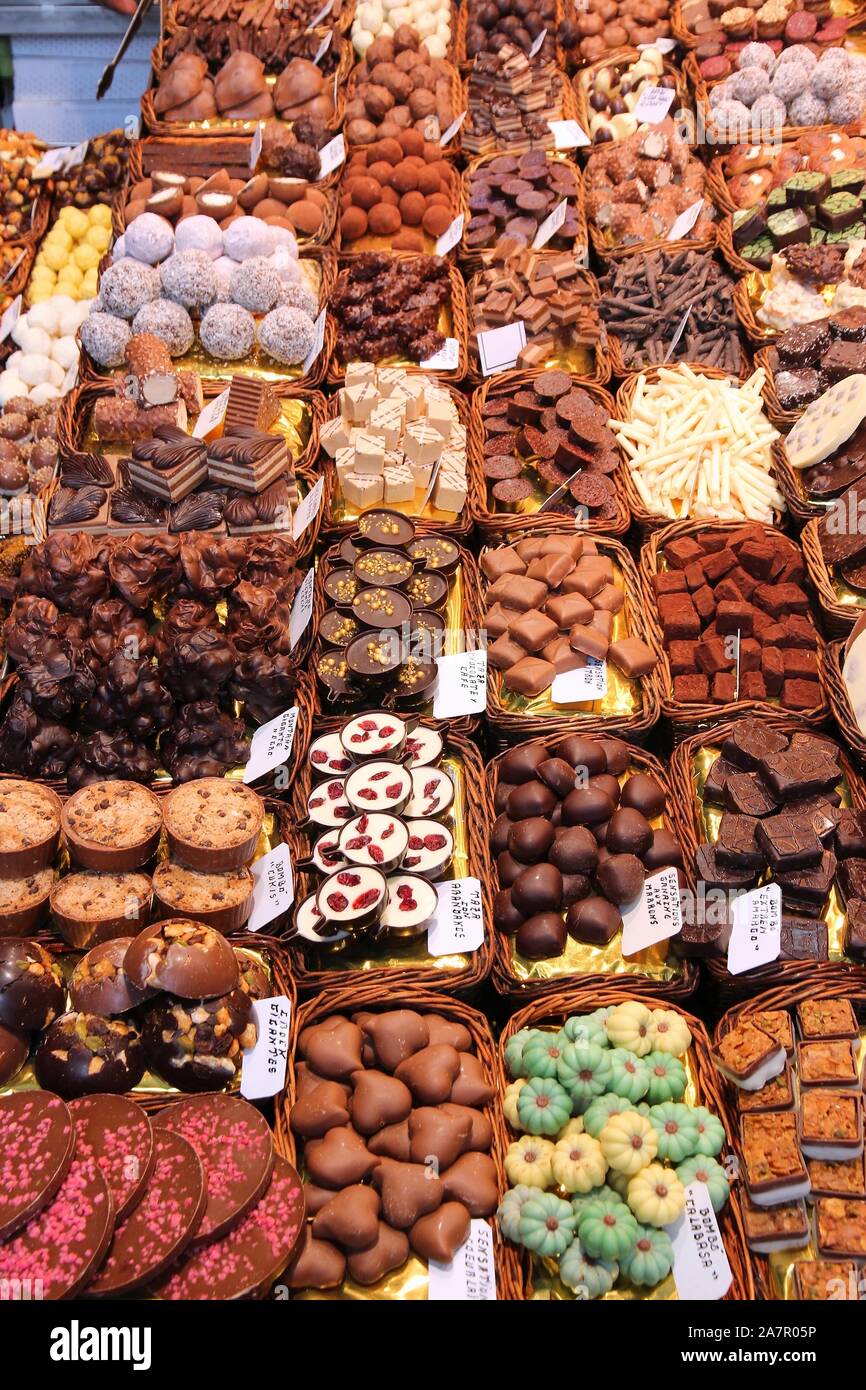 Confectionery at Boqueria market place in Barcelona, Spain. Assorted ...