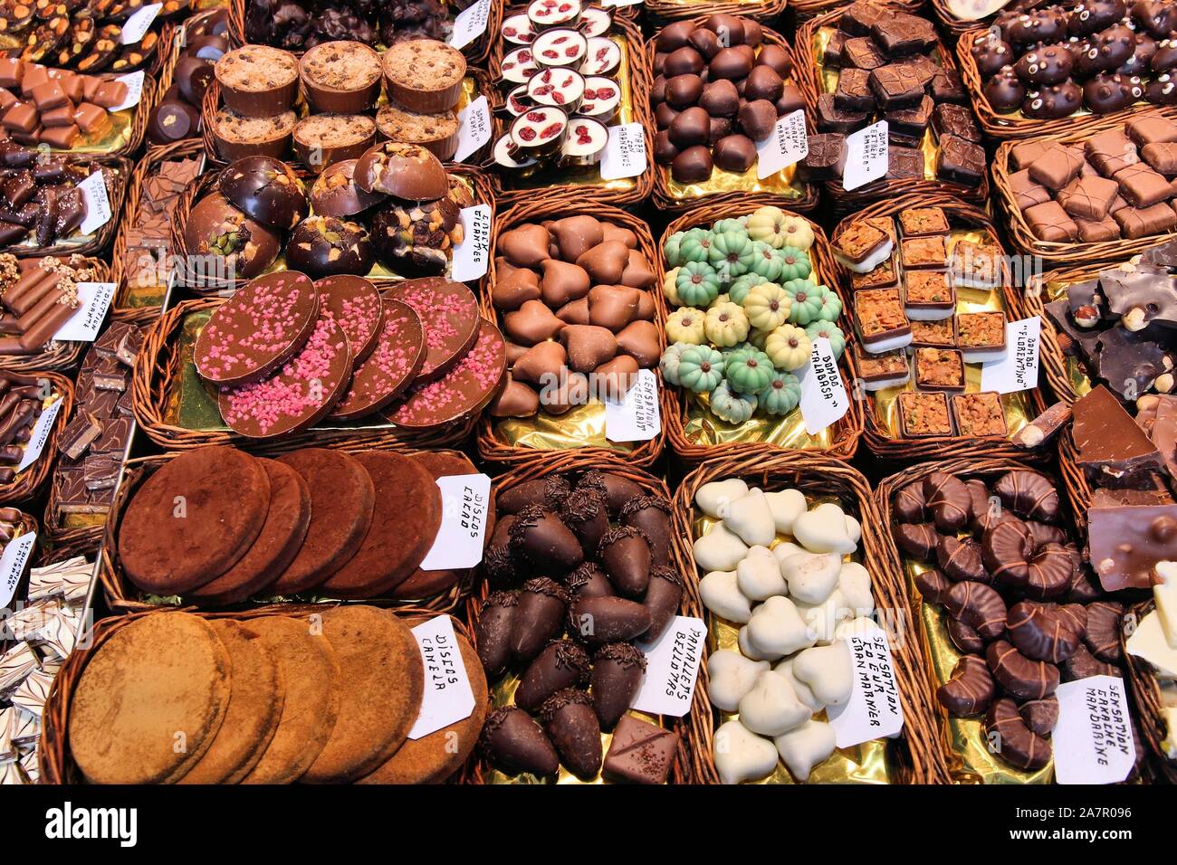 Sweets store at Boqueria market place in Barcelona, Spain. Assorted ...