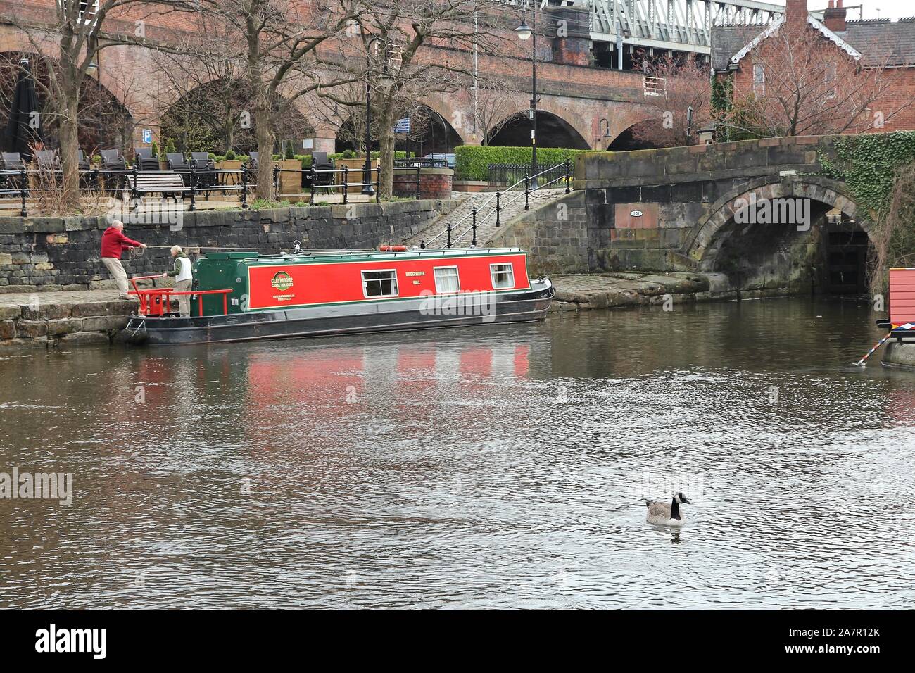 MANCHESTER, UK - APRIL 21, 2013: People visit Castlefield canal area in ...