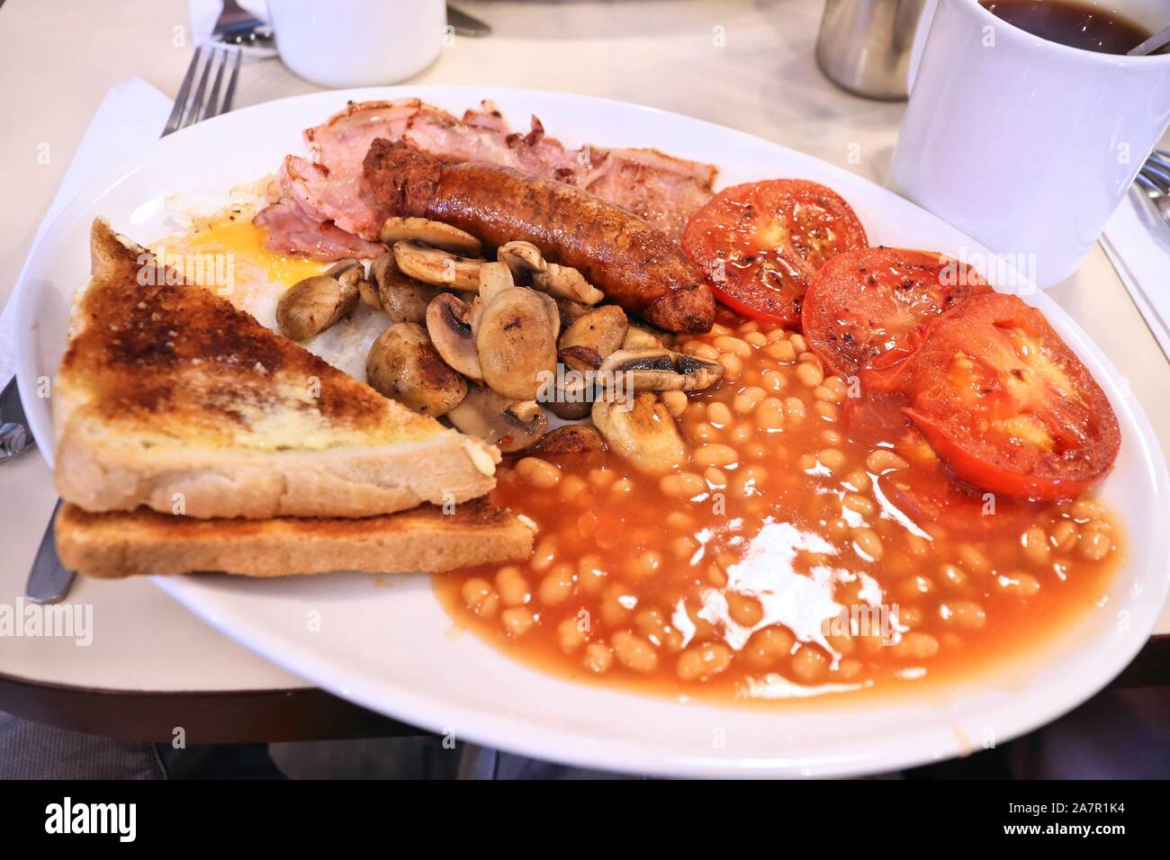 Full English breakfast. Traditional morning meal with toast, bacon ...