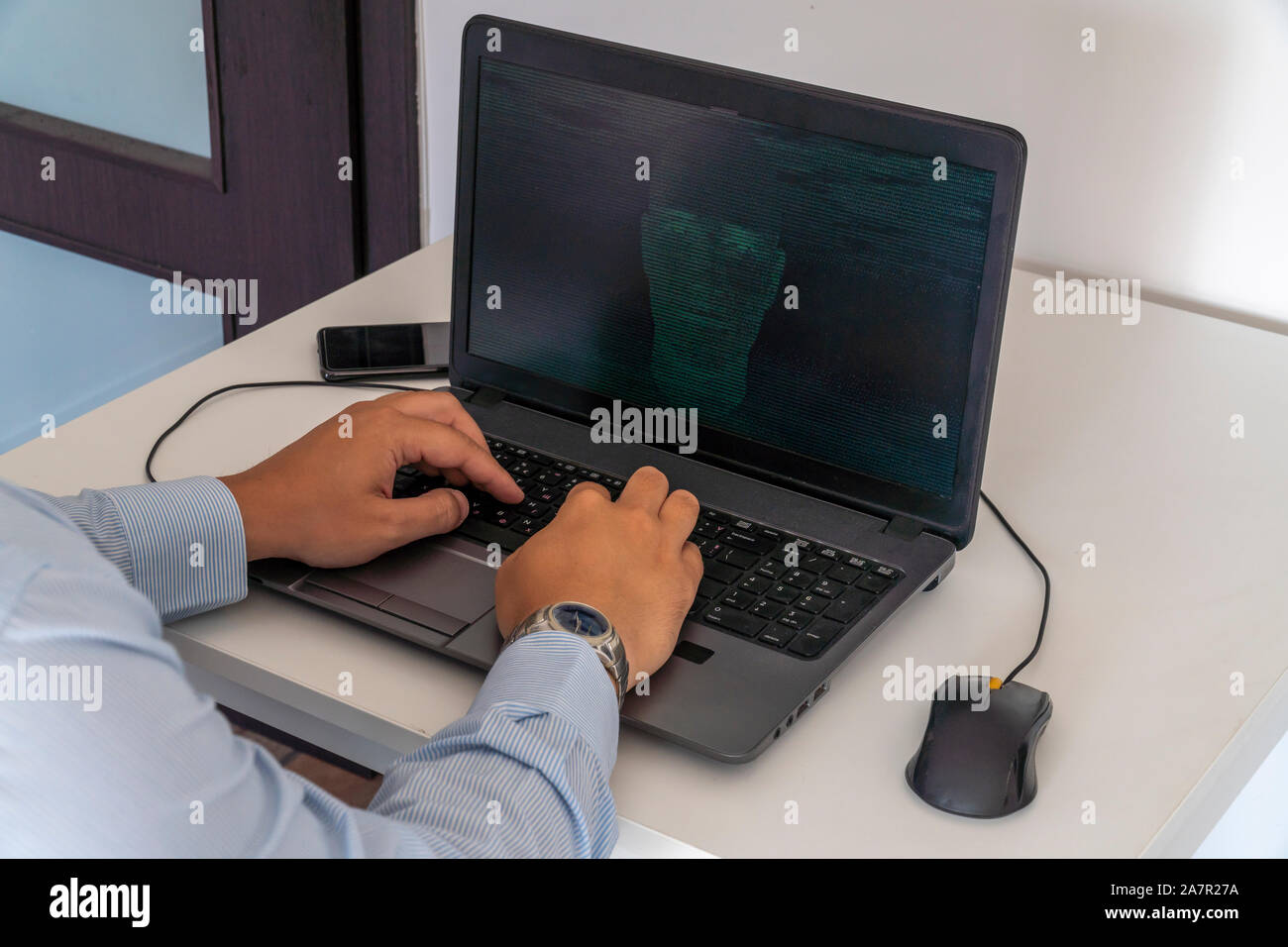 Developer coding on a laptop and creating a artificial intelligence ...