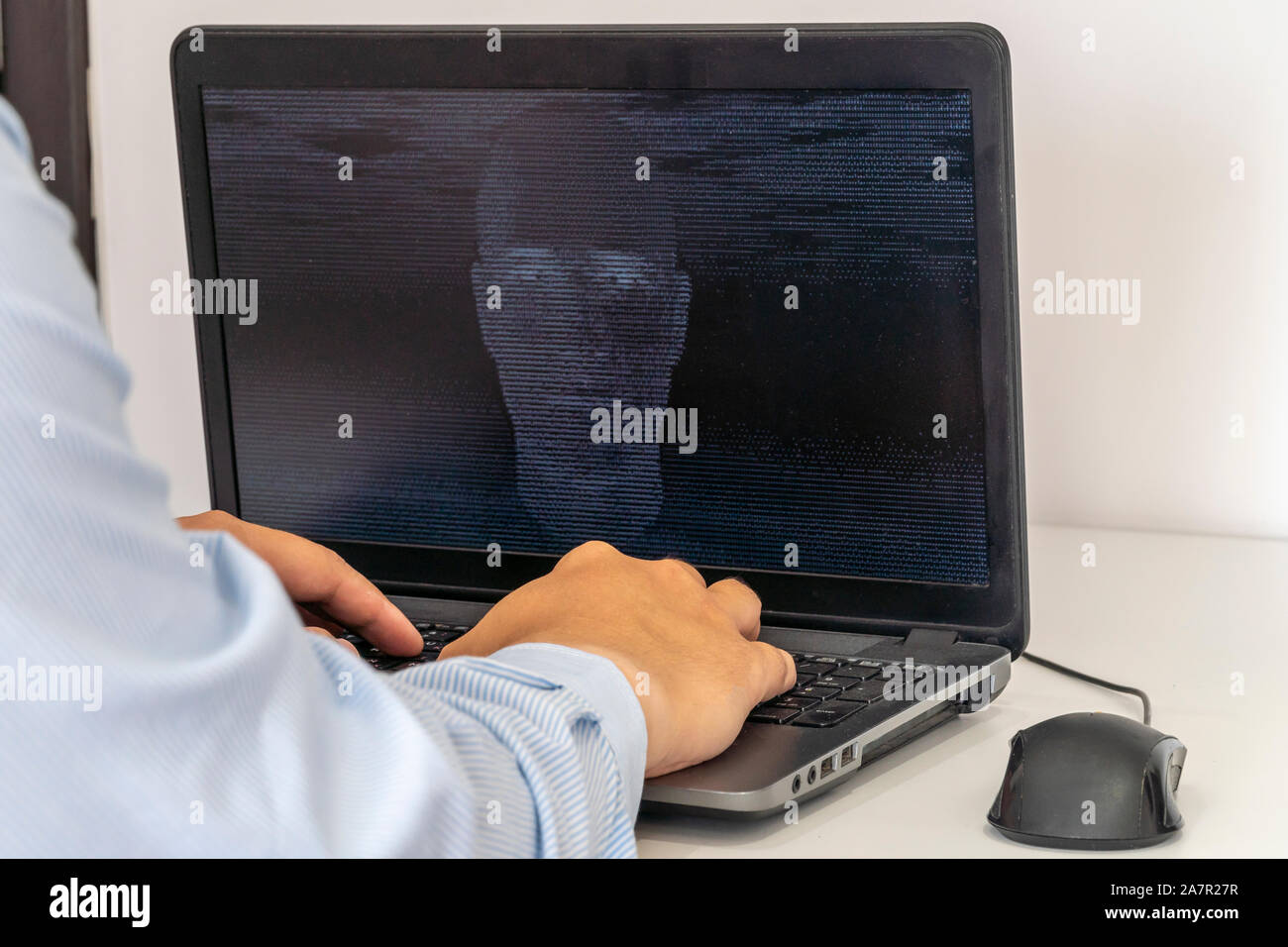 Developer coding on a laptop and creating a artificial intelligence ...