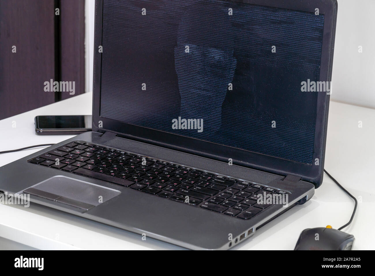 Developer coding on a laptop and creating a artificial intelligence ...