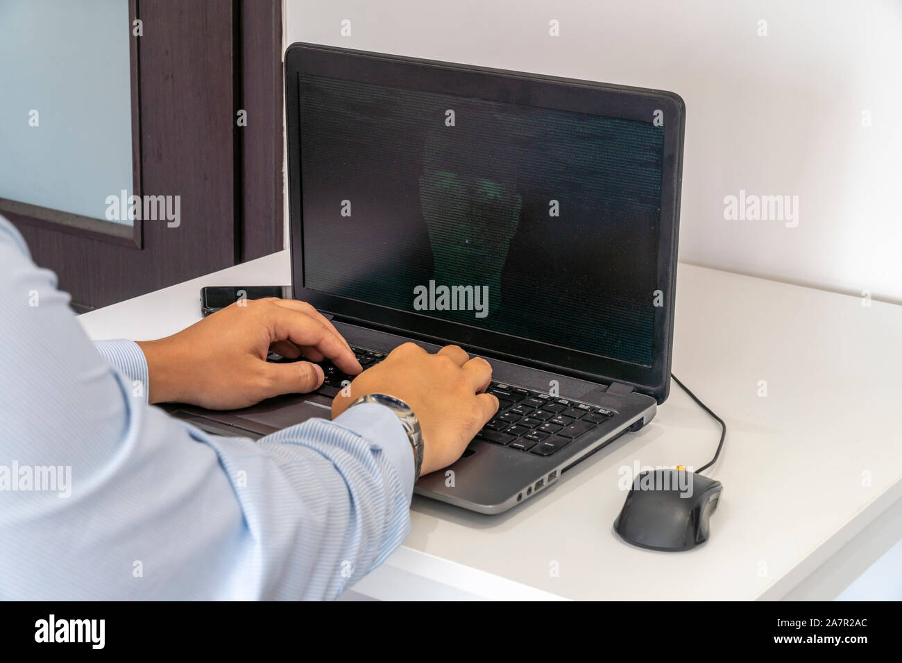 Developer coding on a laptop and creating a artificial intelligence ...