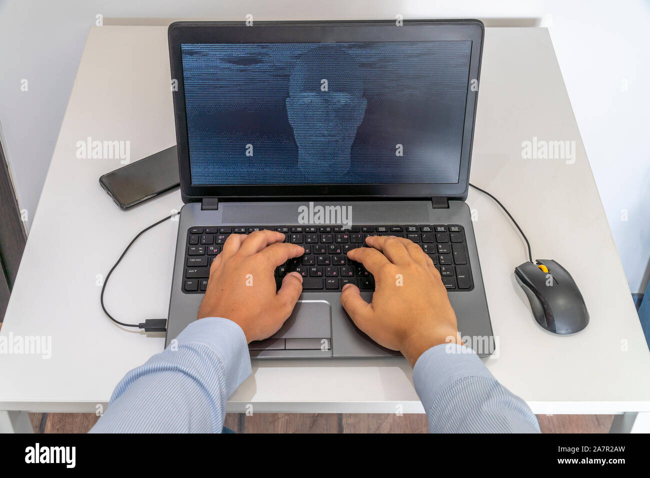 Developer coding on a laptop and creating a artificial intelligence ...