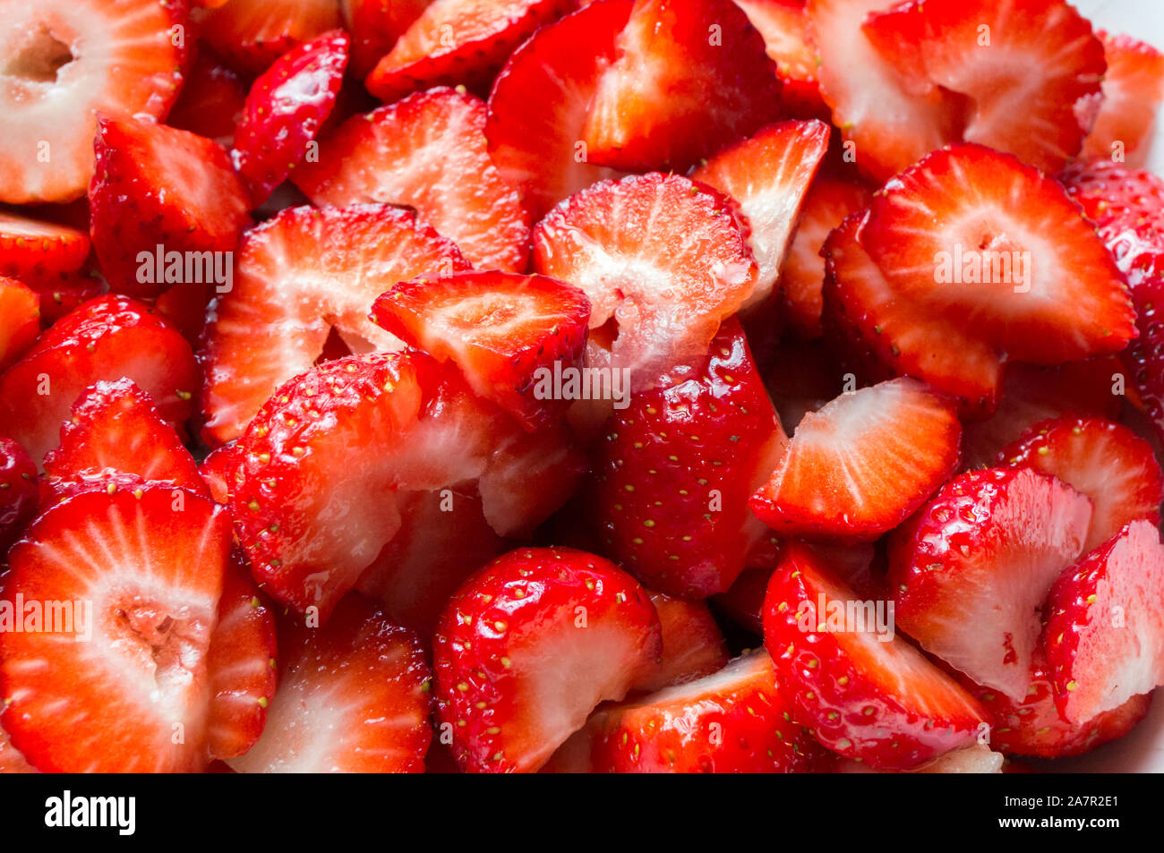 red strawberry cut into small pieces Stock Photo - Alamy