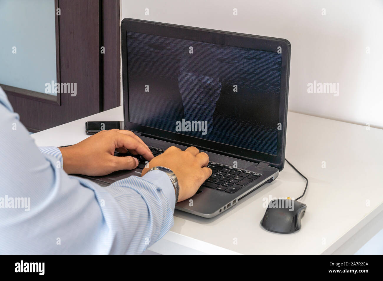 Developer coding on a laptop and creating a artificial intelligence ...