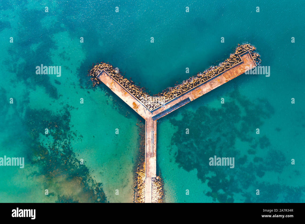 Aerial view of sea, coast and wave breaker stones Stock Photo - Alamy