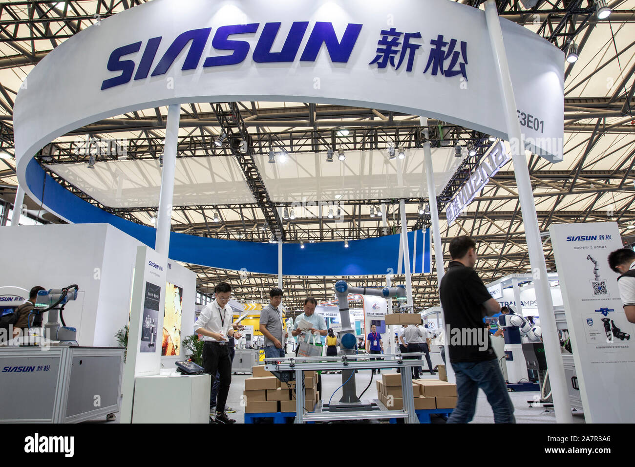 --FILE--People visit the stand of Siasun Robot & Automation Co during ...