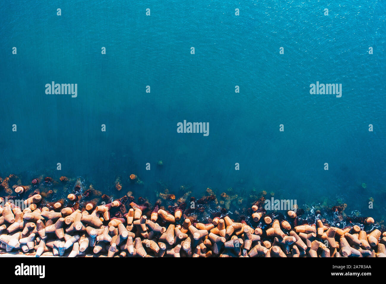 Aerial view of sea, coast and wave breaker stones Stock Photo - Alamy