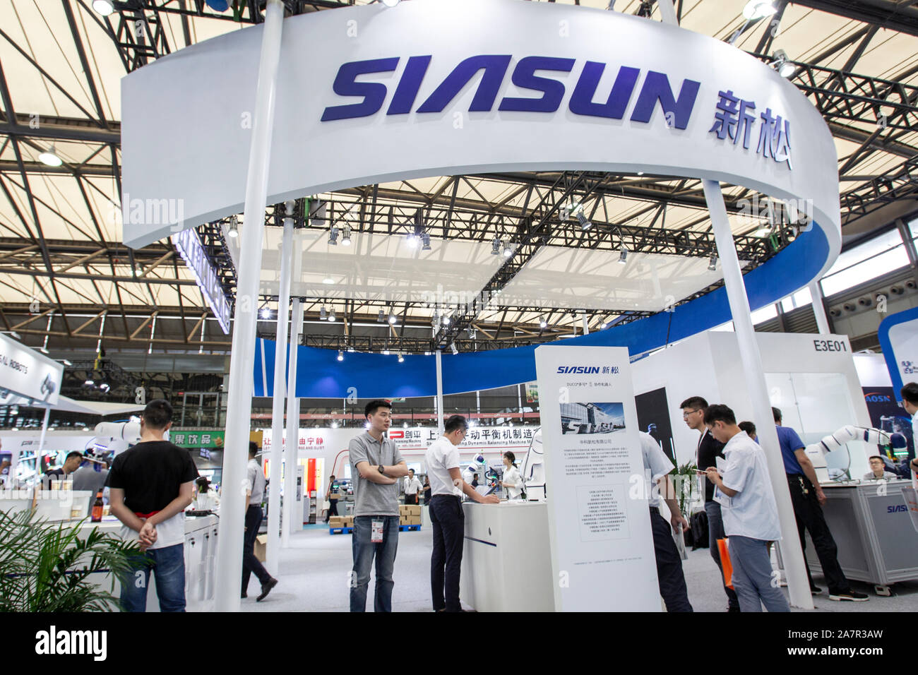 --FILE--People visit the stand of Siasun Robot & Automation Co during ...