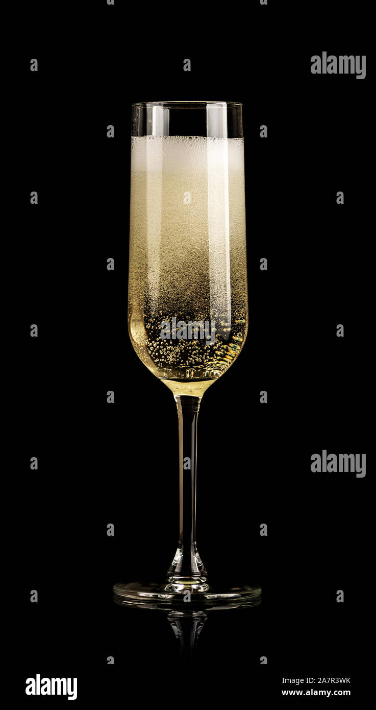 champagne glass with bubbles on black background - new year celebration ...