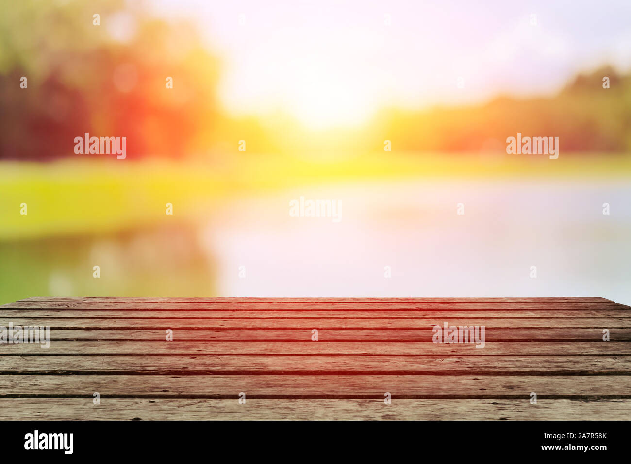 Lake outdoor with Wooden board pier sunset background Stock Photo - Alamy