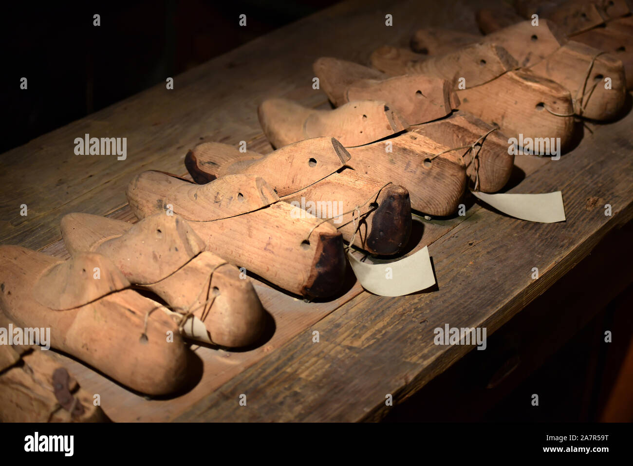 Old wooden shoe trees in a row on shoe workshop Stock Photo - Alamy