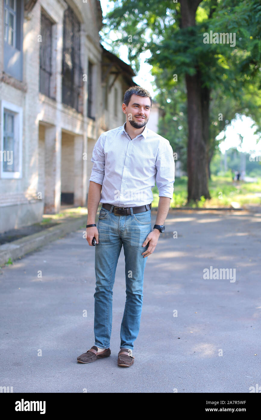 Handsome male man guy smiling and standing still on street road Stock ...