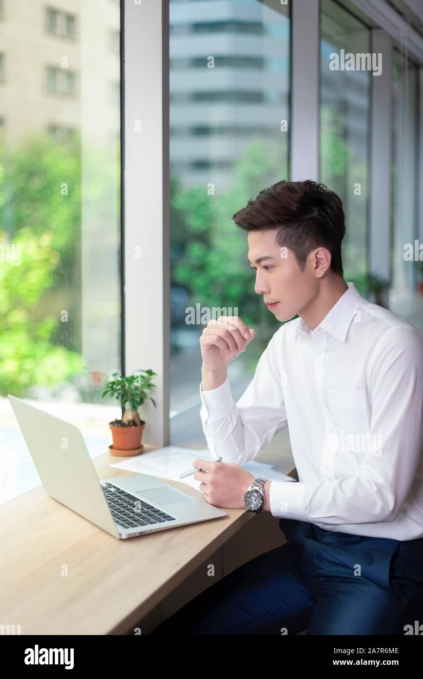 Man sitting down office up hi-res stock photography and images - Alamy
