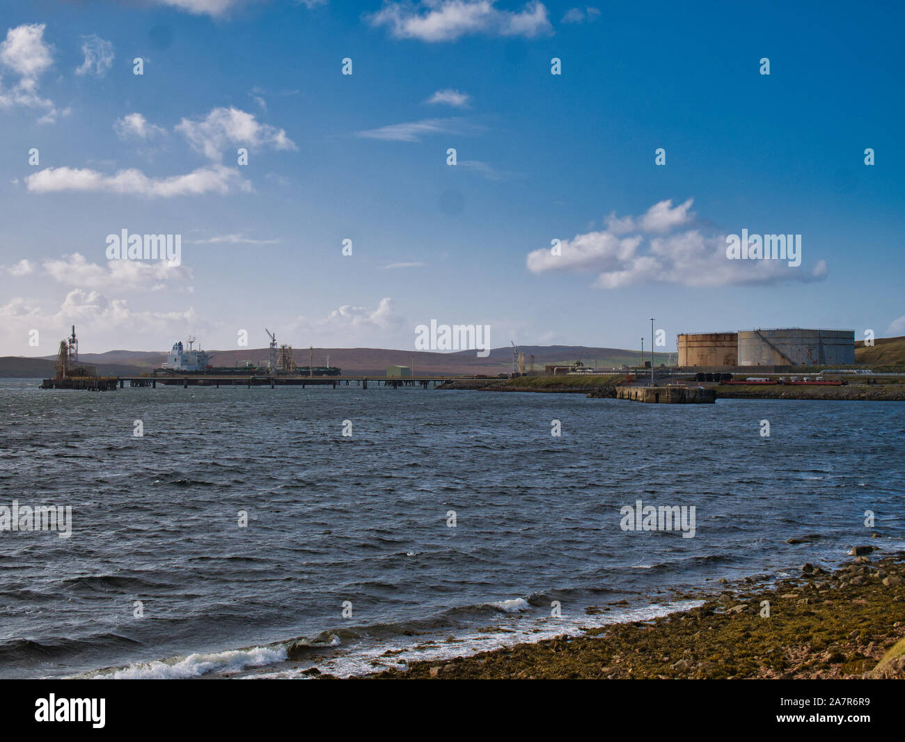 Oil tanker and jetty at Sullom Voe Oil Terminal and Gas Plant in ...
