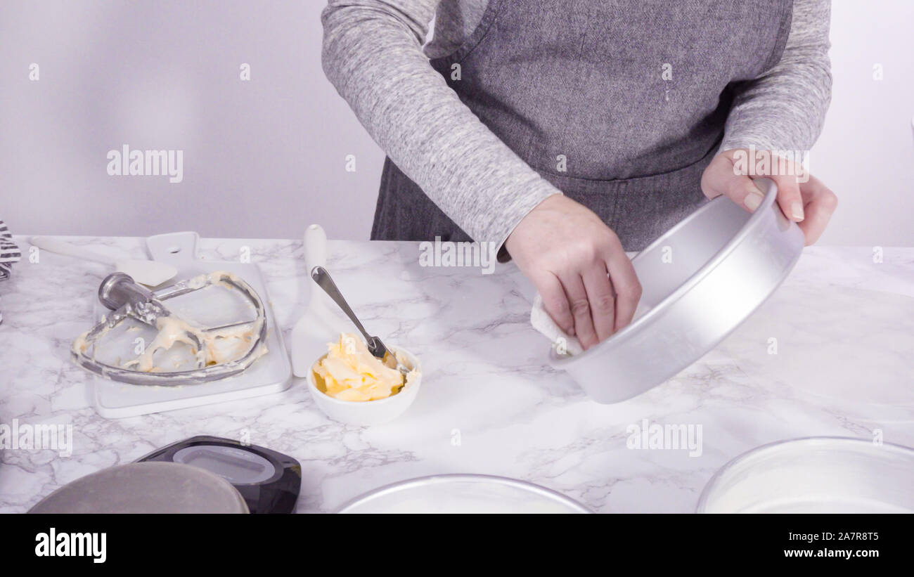 Step by step. Greasing cake pans with butter to bake funfetti cake ...
