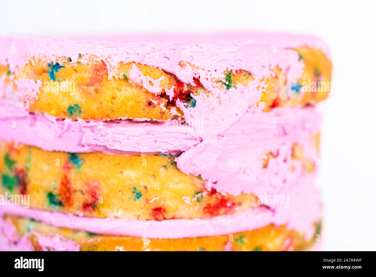 Funfetti cake layers with pink buttercream frosting Stock Photo - Alamy