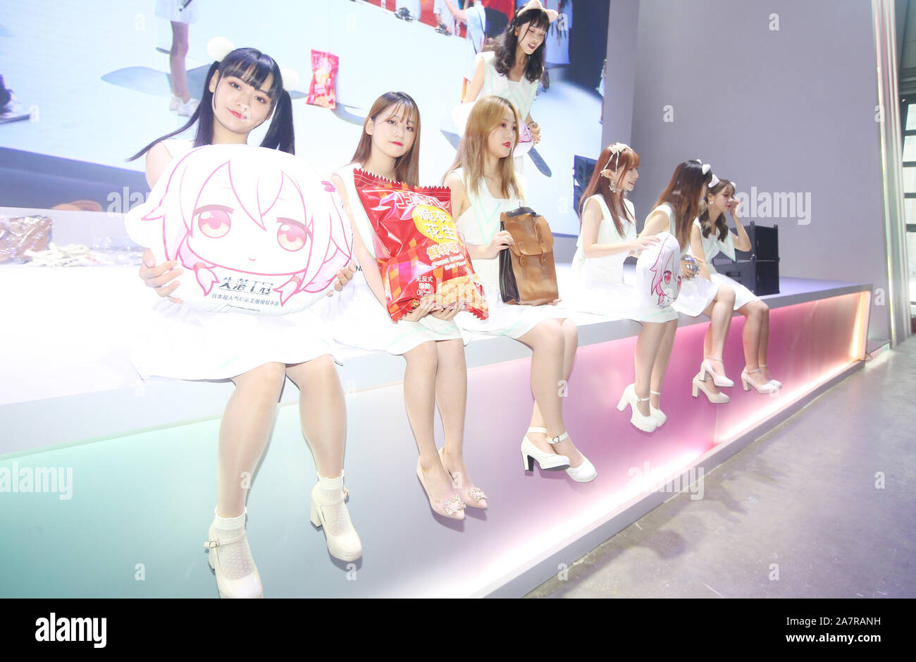 Chinese showgirls pose during the 17th China Digital Entertainment Expo ...