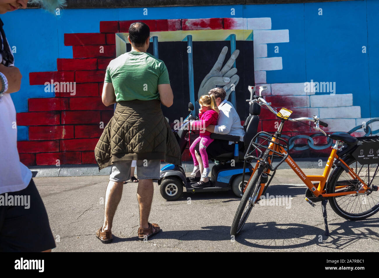 Berlin wall, People at wall East Side Gallery Germany Stock Photo - Alamy