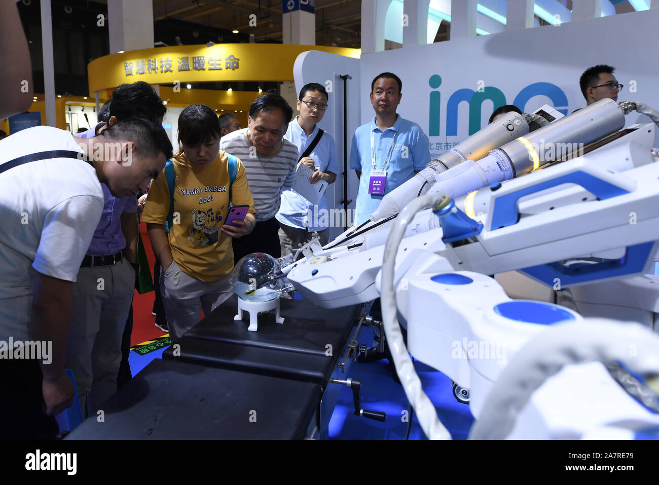 A surgical robot of laparoscopy puts sutures on a grape during the 2019 ...