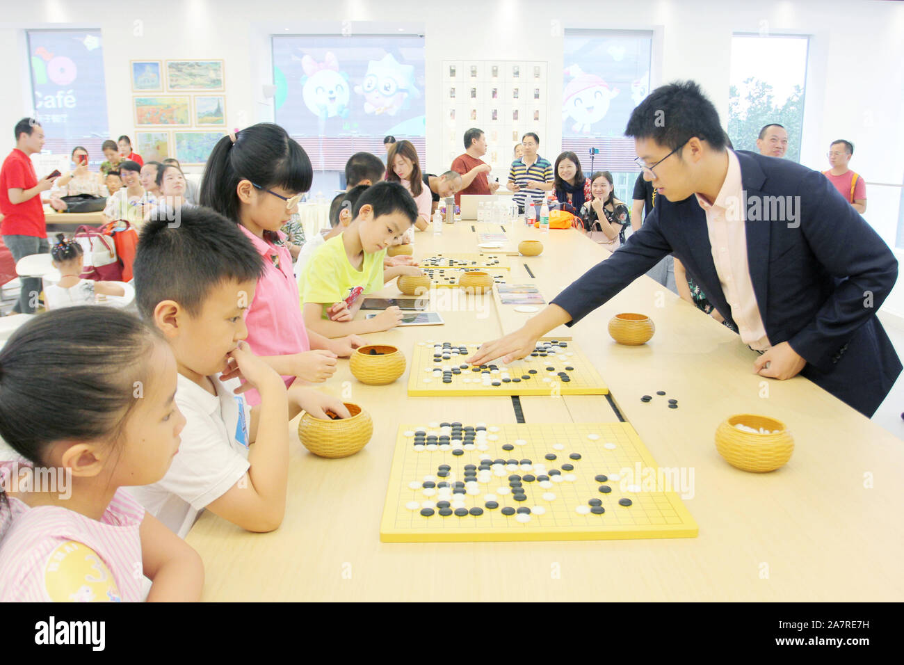 Tan Xiao, the one in black suit, a Chinese professional Go player and ...